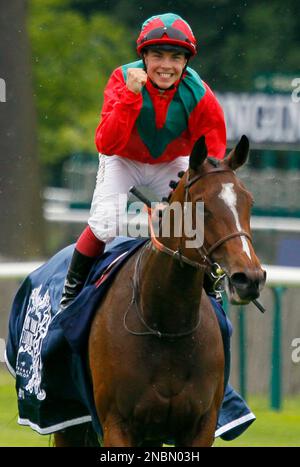 French jockey Maxime Guyon riding Golden Lilac reacts after he wins the ...