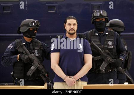 Jose Jorge Balderas Garza, aka "J.J.,", center left, is presented to ...