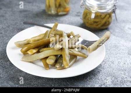 Canned green beans on grey table, top view. Space for text Stock Photo ...