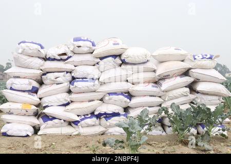 A stack of sacks of crop fertilizer on farm for spreading Stock Photo ...
