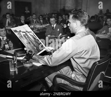 Roy Cohn, aide to Senator Joseph McCarthy (R-Wis.), asks a question in ...