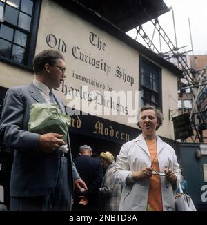 London 1972. A couple seemingly tourists at Piccadilly Circus in London ...
