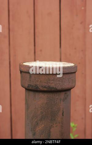 Solid steel post standing in the fields in a black and white Stock ...
