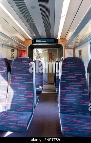 A Greater Anglia class 720 Aventra electric train on the West Coast Main Line alongside the ...