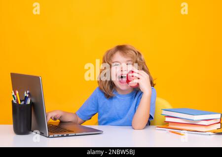 Teenager child with apple on yellow isolated background. apples are ...