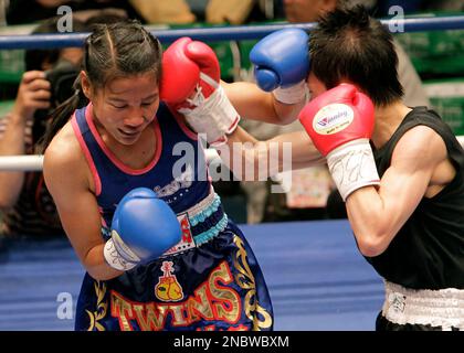Japanese champion Momo Koseki, right, sends a left to Philippine ...