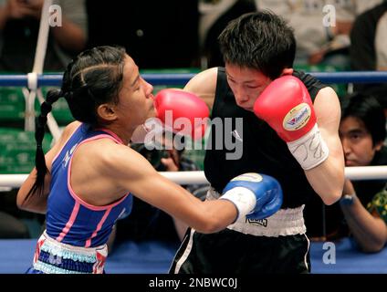 Japanese champion Momo Koseki, right, sends a left to Philippine ...