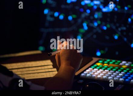Air traffic controllers works in a portable control tower during ...