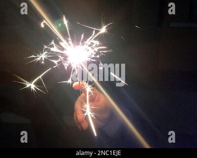 Hand-lit fireworks for New Year's Eve Stock Photo - Alamy