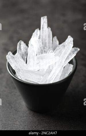 Menthol crystals in bowl on white background, top view Stock Photo - Alamy