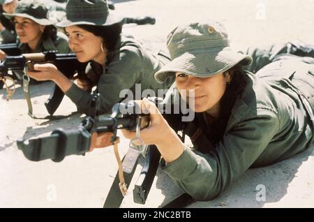 A contingent of Libyan women soldiers undergo Guerrilla training at a ...