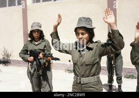 A contingent of Libyan women soldiers undergo Guerrilla training at a ...