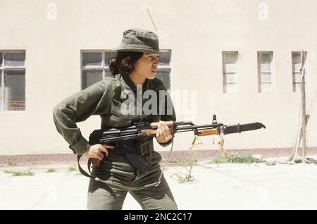 A contingent of Libyan women soldiers undergo Guerrilla training at a ...