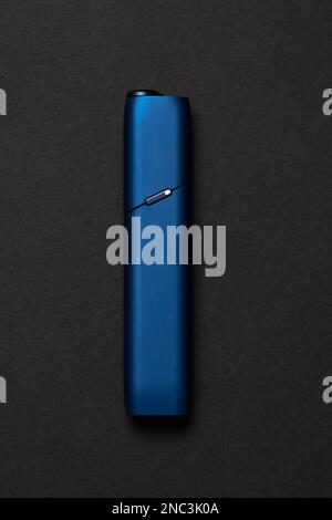 Iqos electronic blue cigarette on a beige background Stock Photo - Alamy