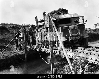 Fifth Army crossing a Pontoon Bridge during World War II in 1944. (AP ...