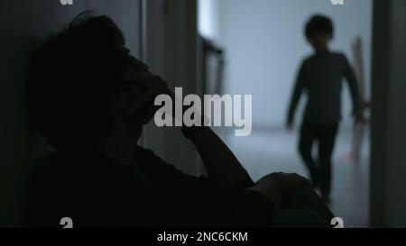 Son hugging father during crisis. Child consoling dad in difficult ...