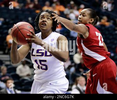 Alabama guard Ericka Russell (23) and LSU guard Katherine Graham chase ...