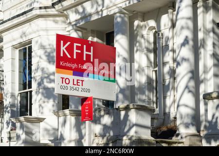 Real estate sign To Let outside terraced houses in Kensington London ...