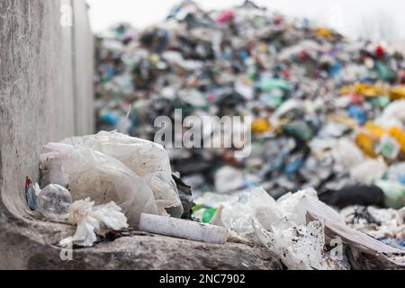 Landfill site, a pile of stinky different junk disposal in the concrete ...