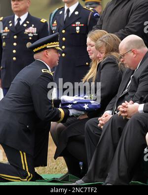 The family of Army Spc. Sean R. Cutsforth attends his funeral service ...