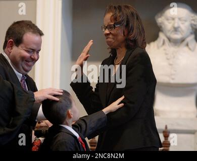 U.S. District Judge Denise Jefferson Casper takes the oath of office ...