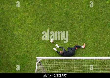 Soccer goalkeeper goalkeeper intervention - view from above Stock Photo ...