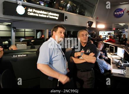 Charles Elachi, director of NASA's Jet Propulsion Laboratory looks at a ...