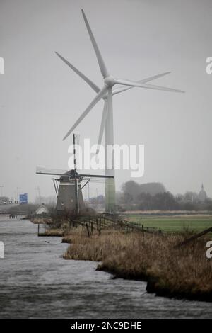 Windmill turbines at sea seen from a drone aerial view from above at a ...