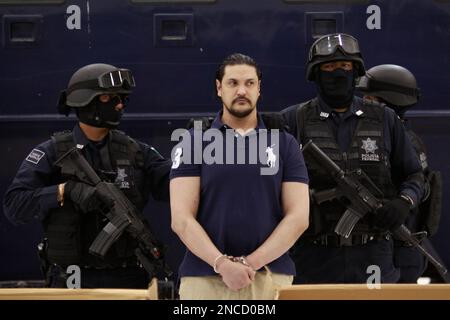 Jose Jorge Balderas Garza, aka "J.J.,", center left, is presented to ...