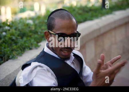 U.S. rapper Jamal "Shyne" Barrow, center, walks down a street in the ...