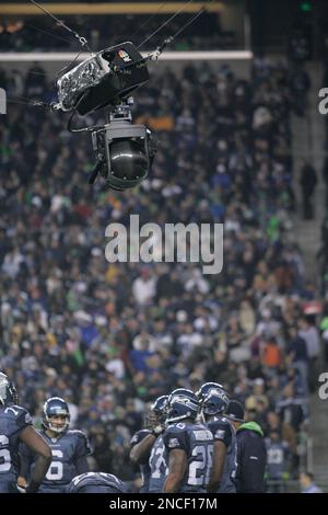 Seattle Seahawks in the huddle, with the overhead camera above them ...