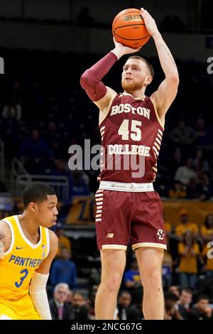 Boston College guard Mason Madsen hangs onto the ball while pressured ...