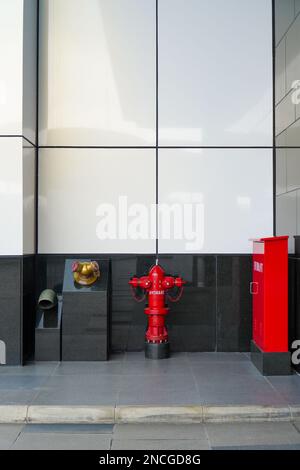 Firefighting equipment with red metal frame, buckets, shovel and hook ...