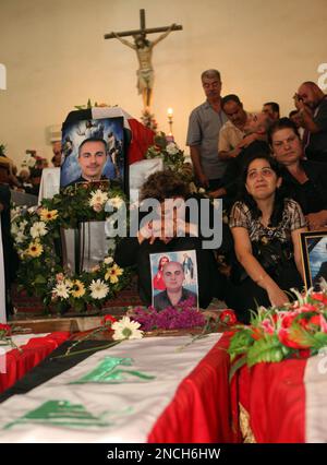 A view of various family members' coffins, caskets, stacked in their ...