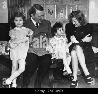 German Chancellor Adolf Hitler is shown at a movie premiere in Berlin ...