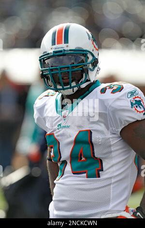 Ricky Williams Miami Dolphins football players distribute meals at the ...