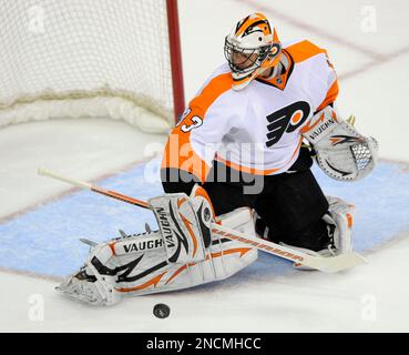 Philadelphia Flyers goalie Brian Boucher stretches during practice at ...