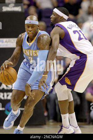 Denver Nuggets' Al Harrington (7) collides with Phoenix Suns' Grant ...
