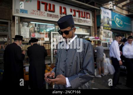 U.S. rapper Jamal "Shyne" Barrow, center, walks down a street in the ...