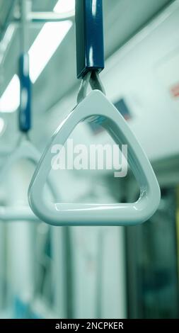 Empty handrails for passenger safety inside the train Stock Photo - Alamy