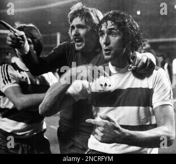(L-R) Queens Park Rangers goalkeeper Phil Parkes dives at the feet of ...
