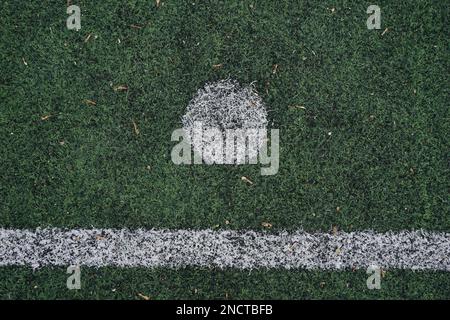 penalty spot, solid white long line and round white point on green ...