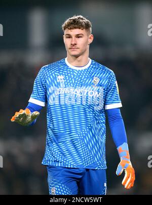 Lincoln City goalkeeper Carl Rushworth saves at the feet of Derby ...