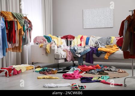Mess of clothes all over room. Fast fashion Stock Photo - Alamy