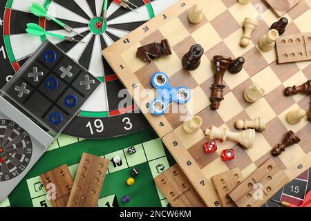 Different types of board games and its' components as background, top ...