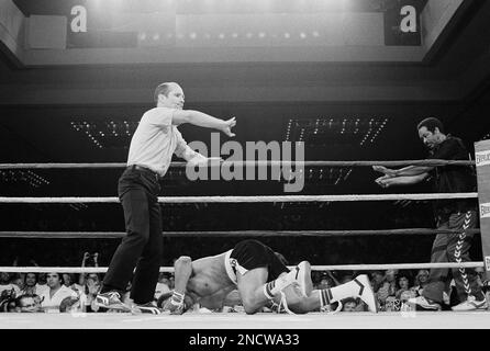 March 23, 1979, Larry Holmes, right, follows through after connecting ...