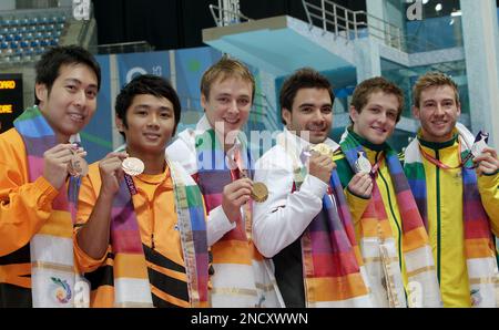 Malaysia's Bryan Nickson Lomas, right, and Ken Nee Yeoh compete to win ...
