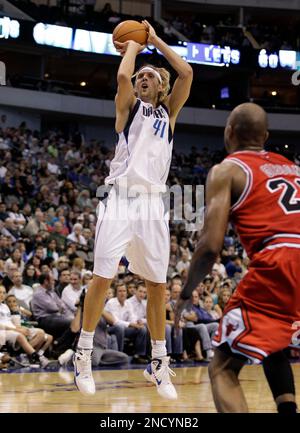 Dallas Mavericks' Dirk Nowitzki (41) looks to pass under pressure from ...