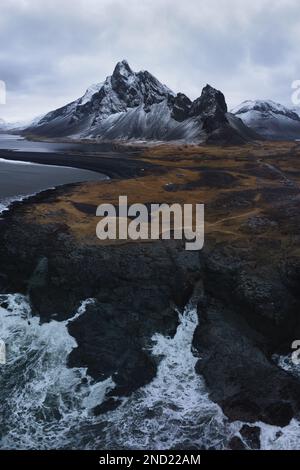 Drone view of a snow covered Eystrahorn mountain in Iceland at Hvalnes ...