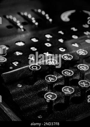 A closeup of black vintage Enigma machine used for encrypting and ...